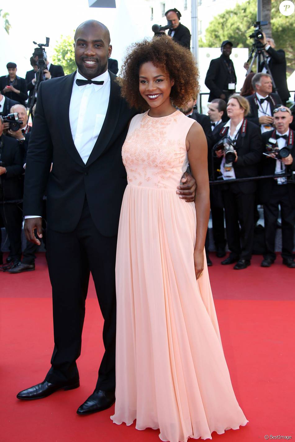 Teddy Riner et sa compagne Luthna - Montée des marches du film Elle ...