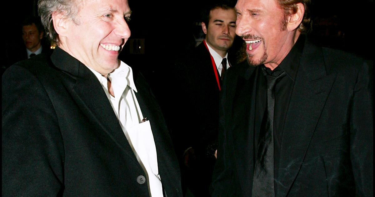Johnny Hallyday et Fabrice Luchini à Paris en mars 2006. - Purepeople