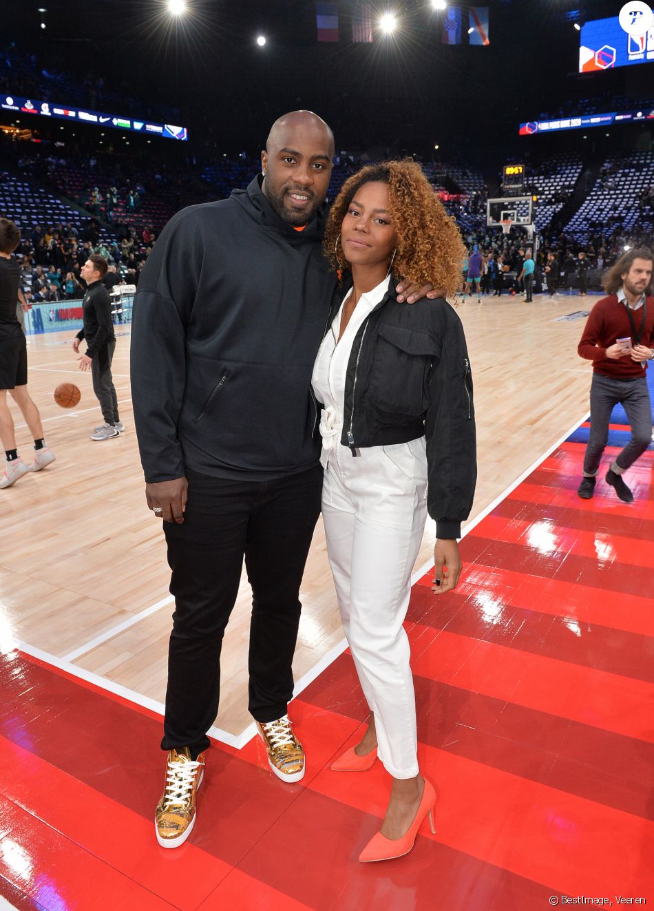 Teddy Riner et sa compagne Luthna Plocus assistent au NBA Game Paris ...