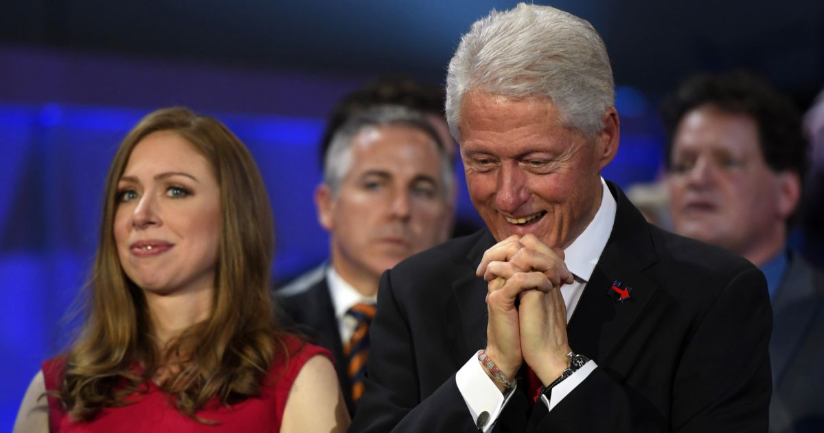 Chelsea Clinton and former President Bill Clinton listen as Hillary ...