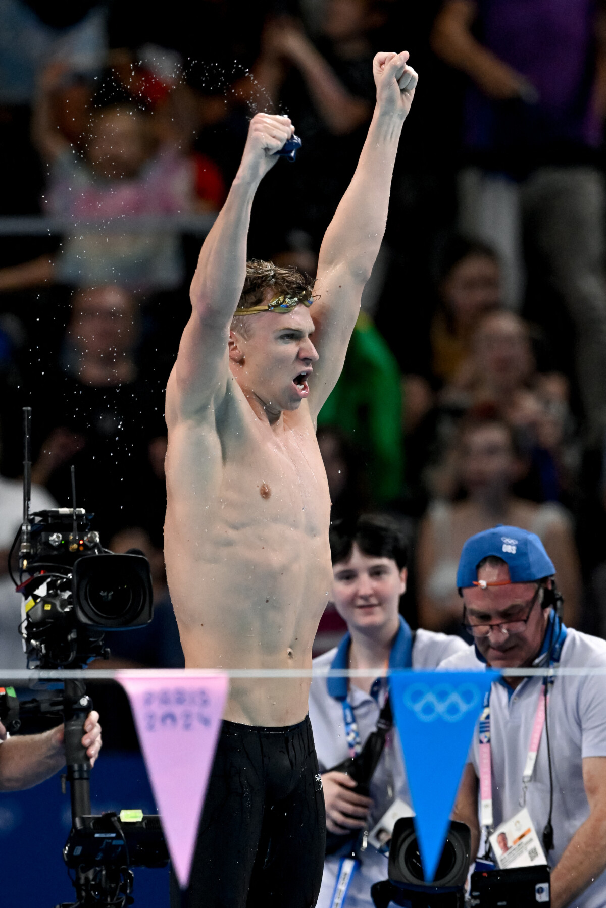 Photo : Leon Marchand of France celebrates after winning the gold medal ...