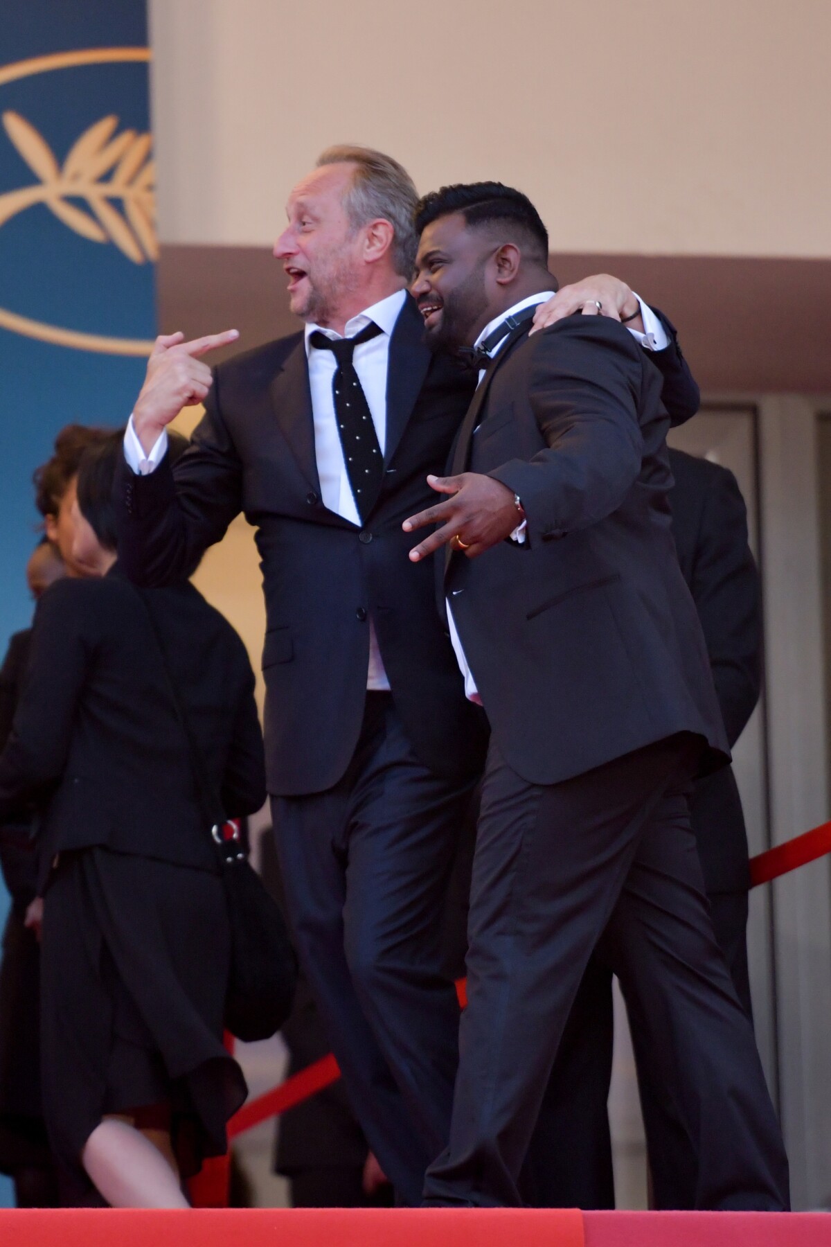 Photo : Benoît Poelvoorde, Thamilchelvan Balasingham - Montée des marches du film « Le Grand ...
