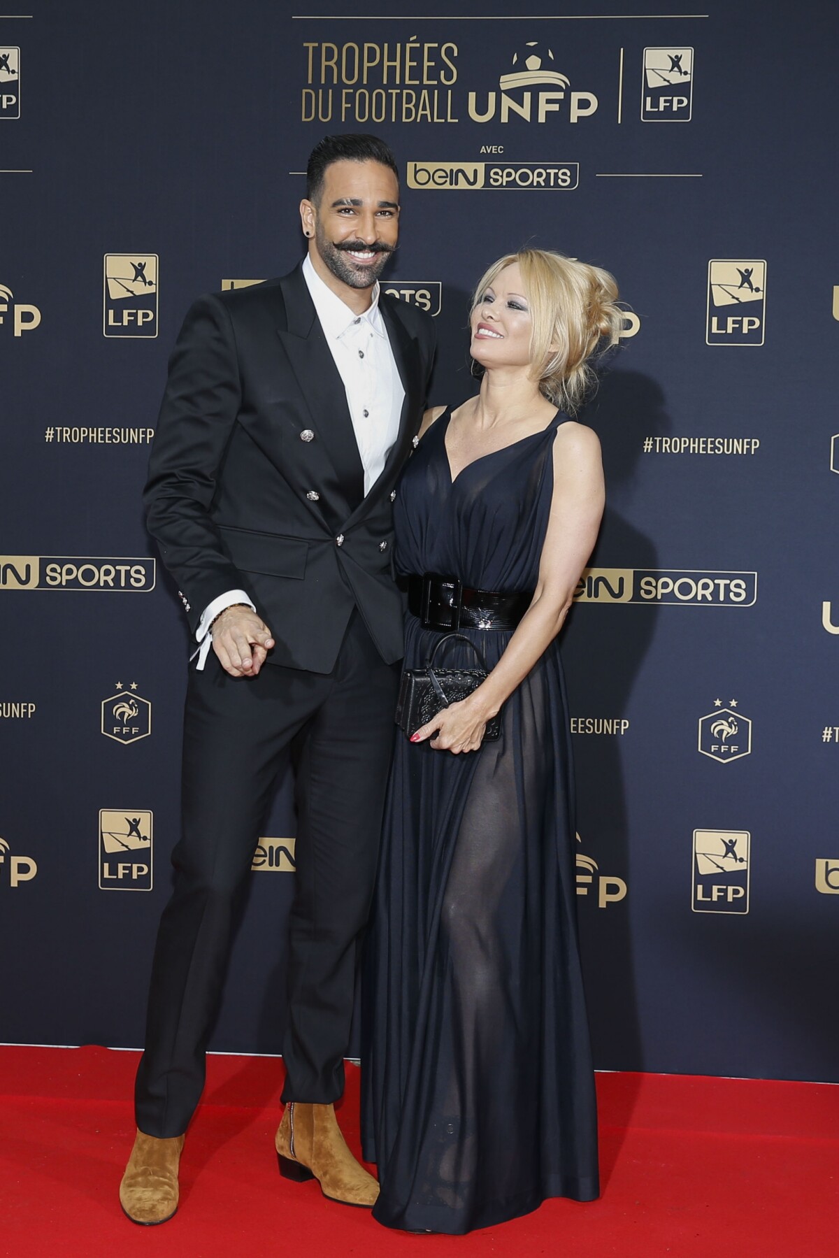 Photo : Adil Rami et sa compagne Pamela Anderson au photocall de la ...