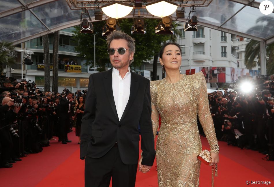Jean-Michel Jarre et sa compagne Gong Li (robe Elie Saab)- Montée des ...