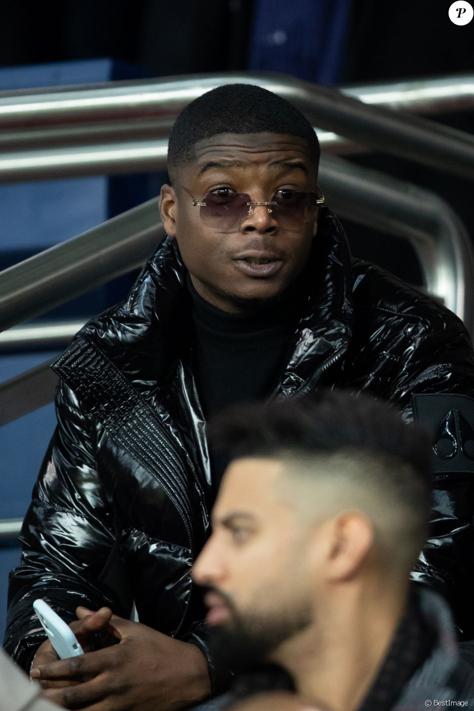 Le rappeur Ninho dans les tribunes lors du match de Ligue 1 opposant le ...