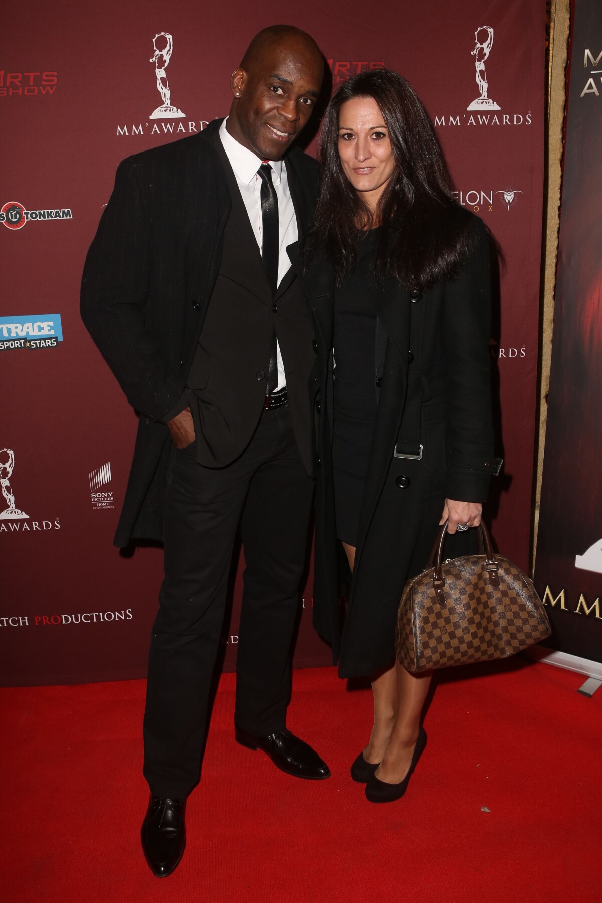 Photo : Xavier Foupa Pokam et sa femme à Paris, le 10 novembre 2013 ...