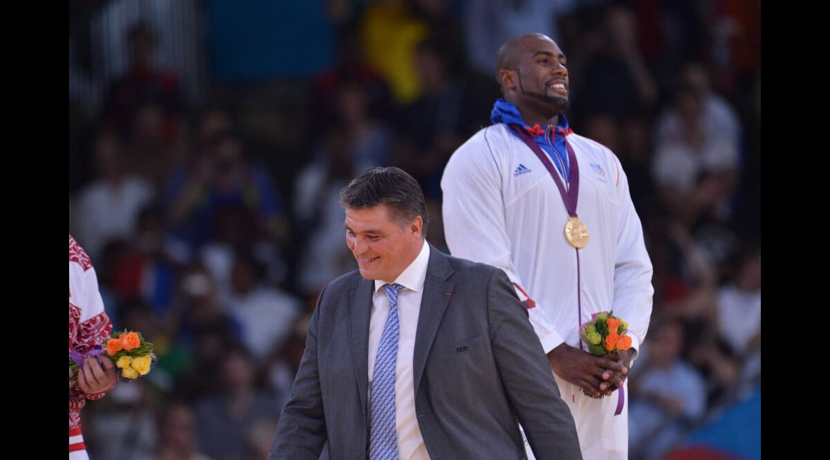 Photo : Teddy Riner et David Douillet lors des JO de Londres le 3 août ...