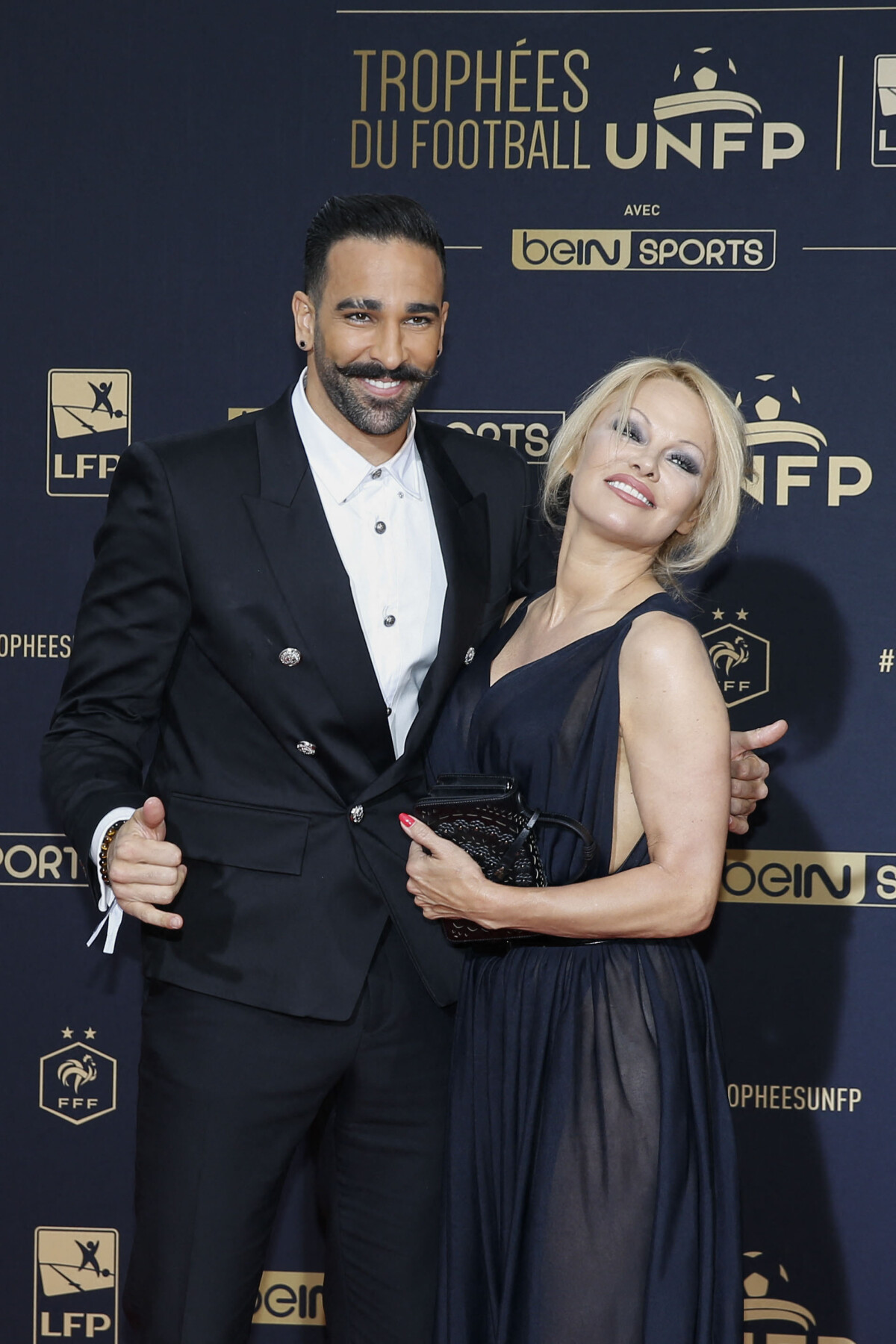 Photo : Adil Rami et sa compagne Pamela Anderson au photocall de la ...