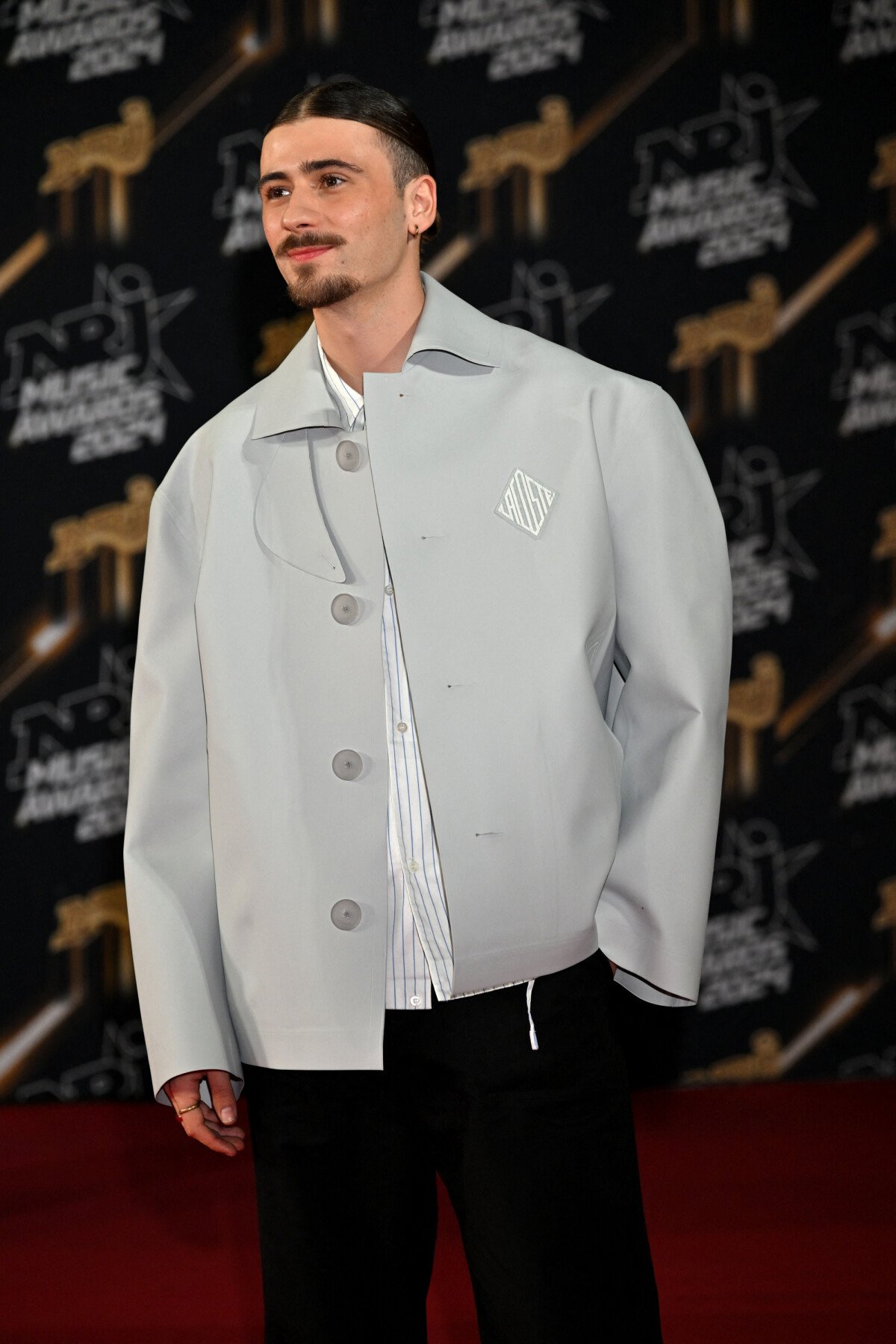 Photo : Pierre Garnier au photocall de la 26ème édition des NRJ Music Awards à Cannes, le 1er ...