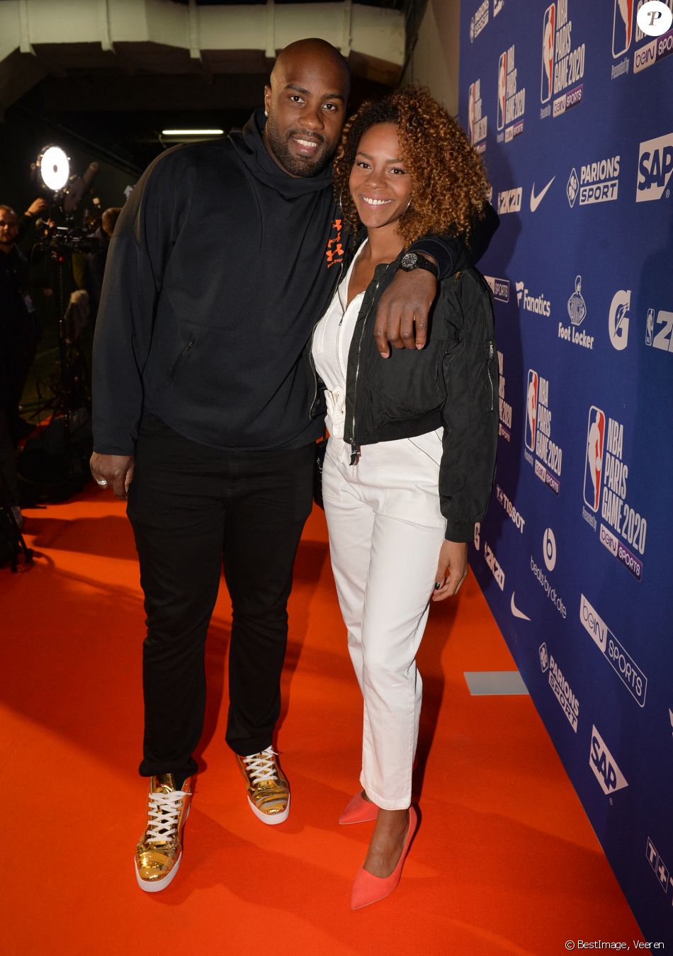 Teddy Riner et sa compagne Luthna Plocus au match de NBA Game Paris ...