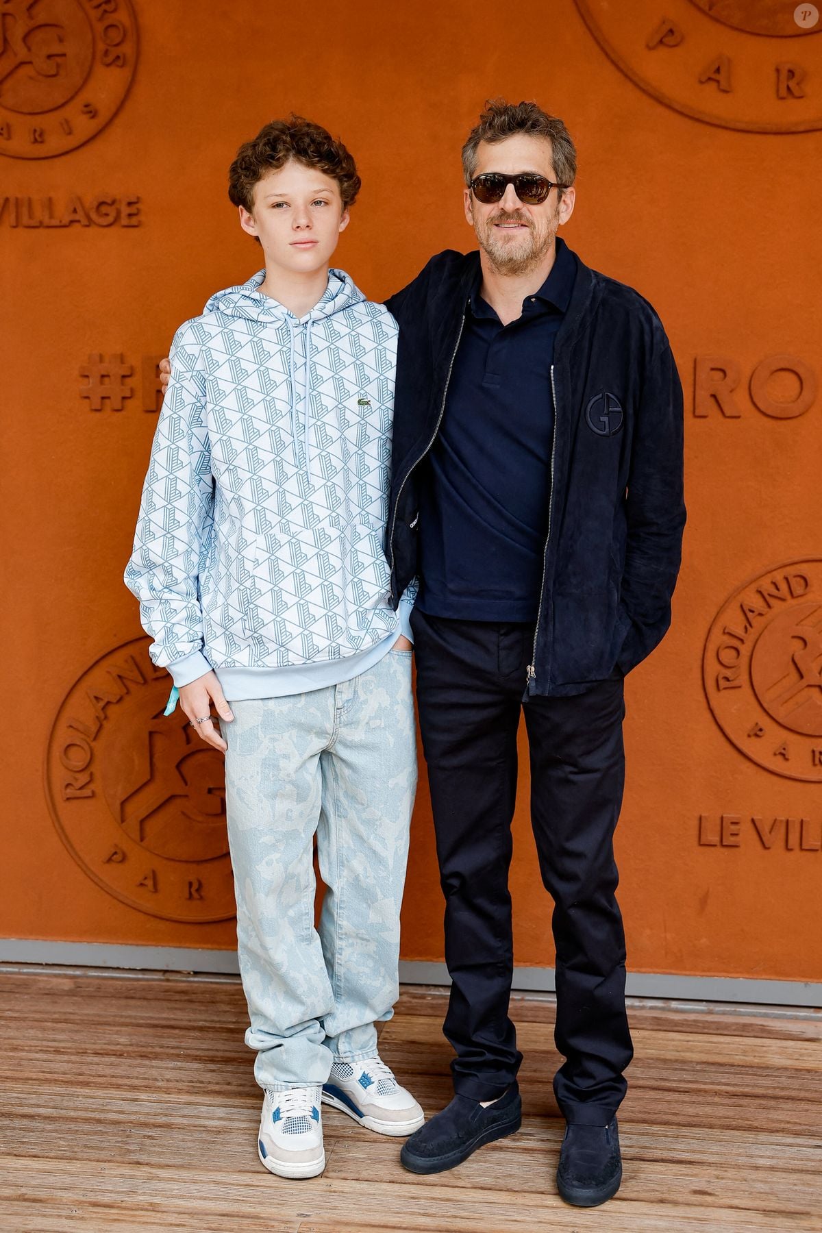 Photo : Guillaume Canet et son fils Marcel au village lors des ...