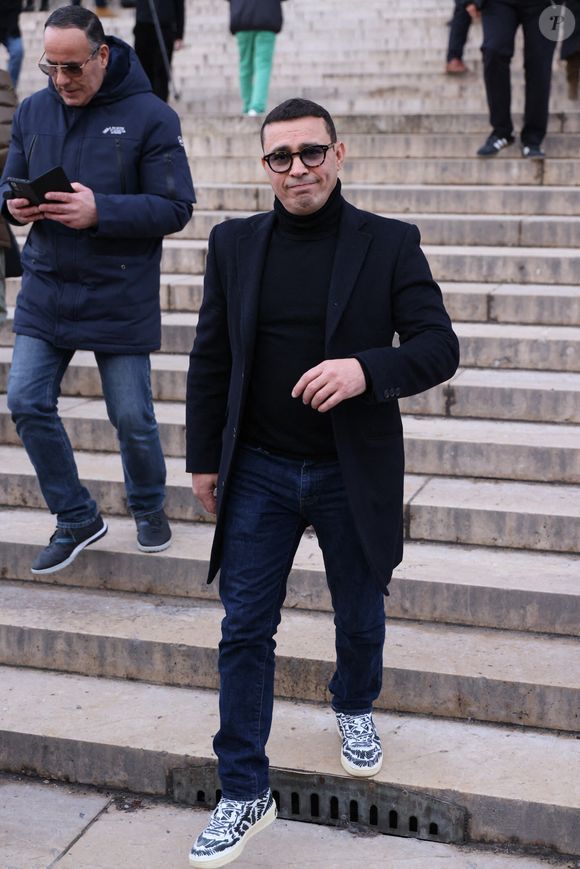 Photo : Brahim Asloum quittant la cérémonie funéraire de Rolland ...