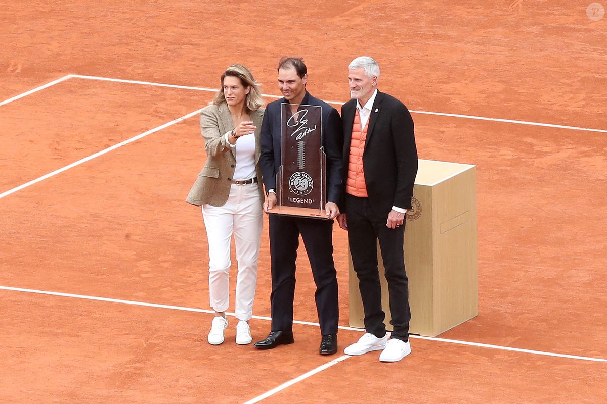 Photo : Rafael Nadal avec Amélie Mauresmo (Directrice du Tournoi) et ...